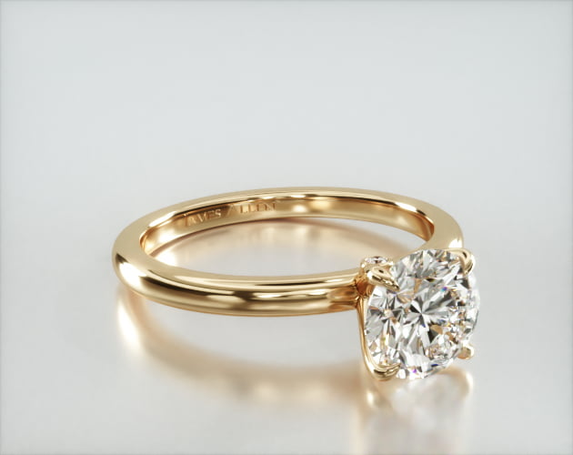 Solitaire Engagement Ring Embellished With a Four Prong Signature Head ...