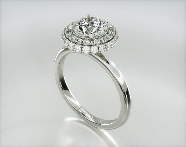 Solitaire Engagement Ring Embellished With a Falling Edge Pavé Halo ...