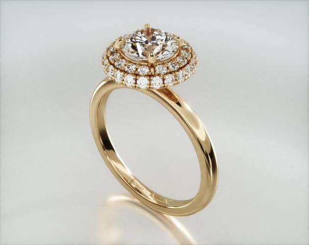 Solitaire Engagement Ring Embellished With a Falling Edge Pavé Halo ...